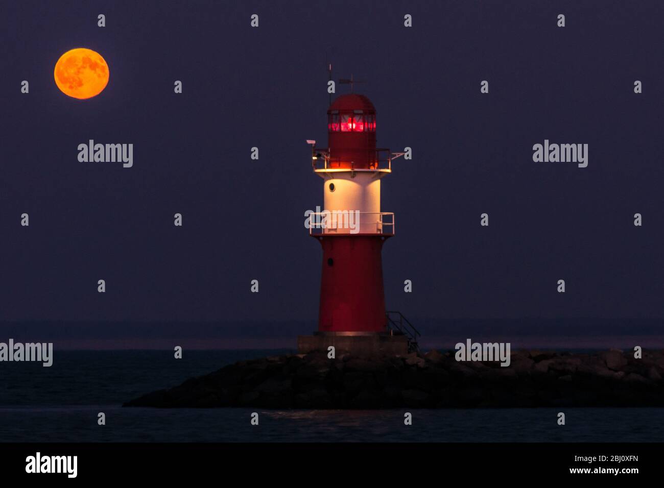 Lighthouse at night moon hi-res stock photography and images - Alamy
