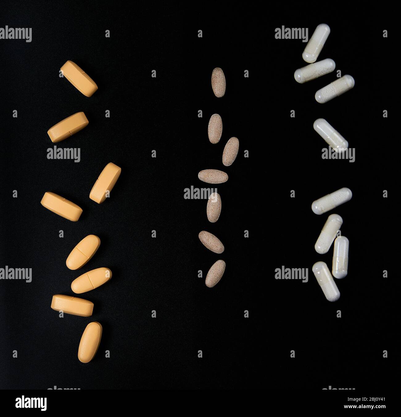 pills in pack on black background square Stock Photo - Alamy