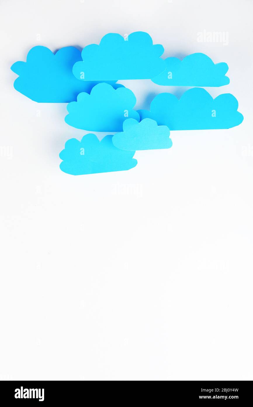 Blue paper clouds, isolated on white. Cloud computing concept Stock ...