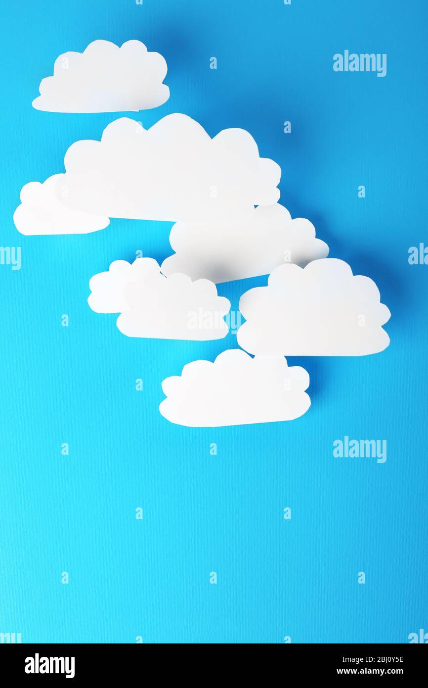 White paper clouds on blue background. Cloud computing concept Stock ...