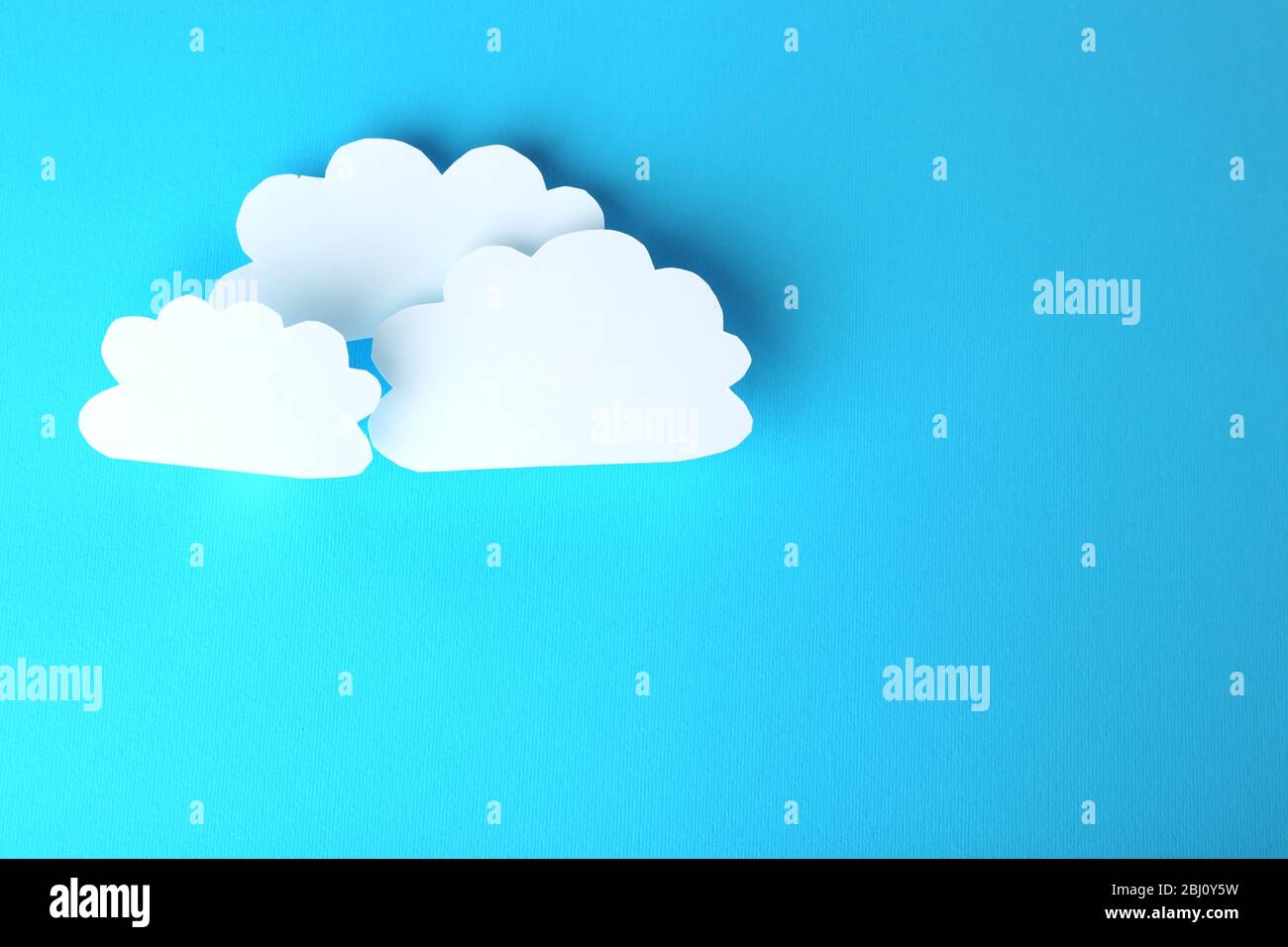 White paper clouds on blue background. Cloud computing concept Stock ...