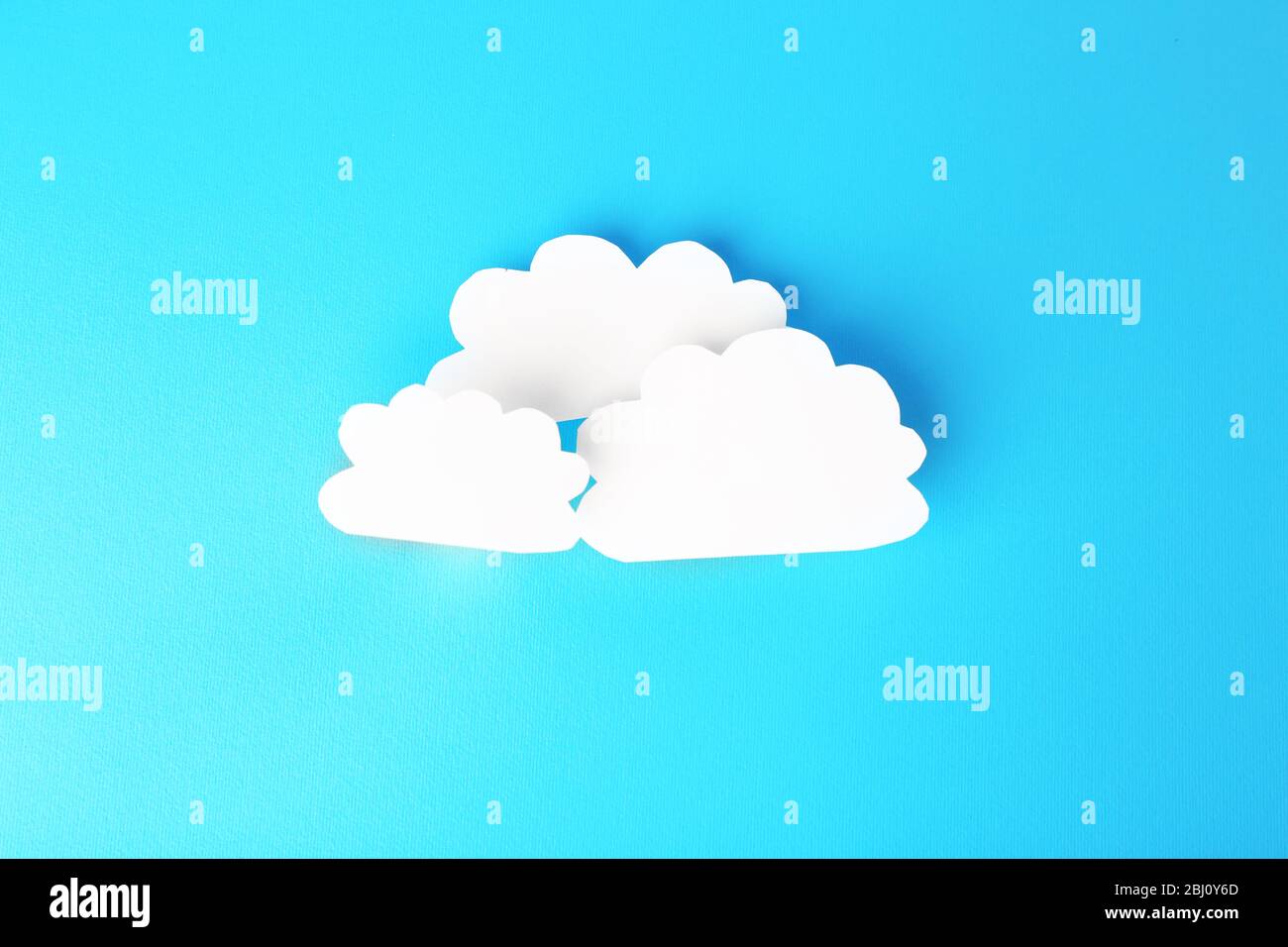 White paper clouds on blue background. Cloud computing concept Stock ...