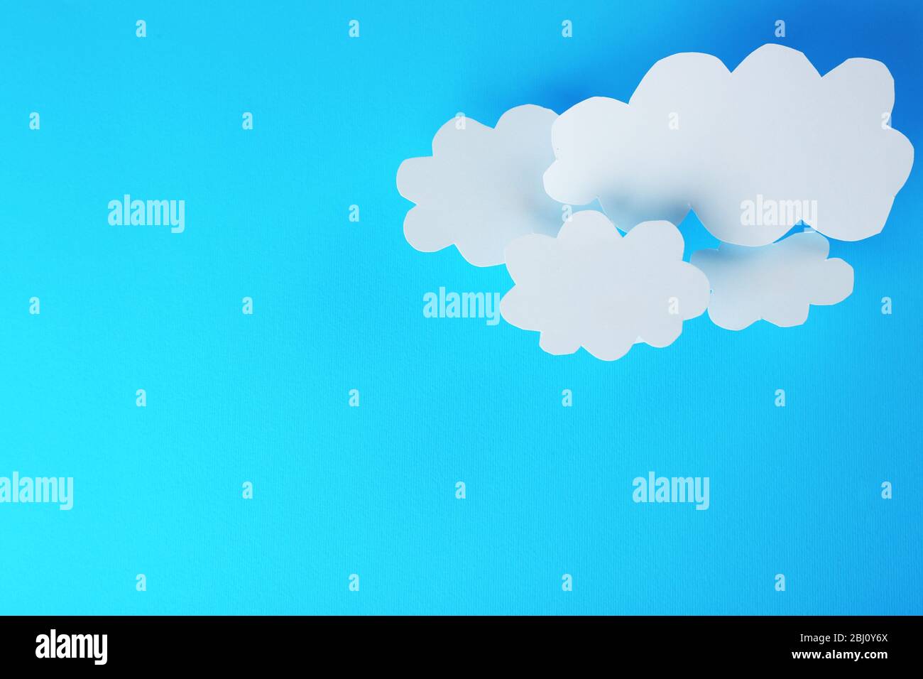 White paper clouds on blue background. Cloud computing concept Stock ...