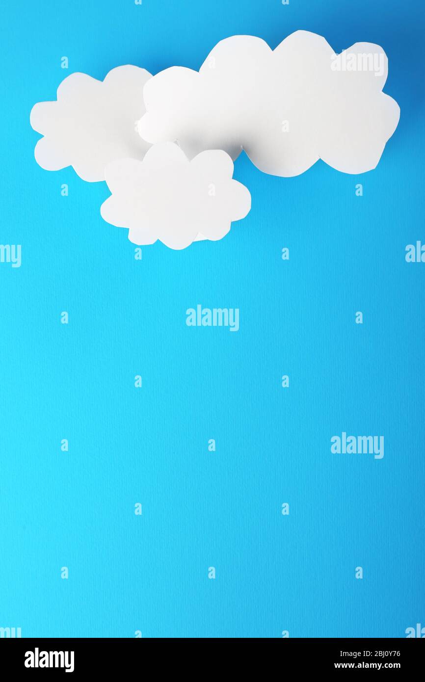 White paper clouds on blue background. Cloud computing concept Stock ...