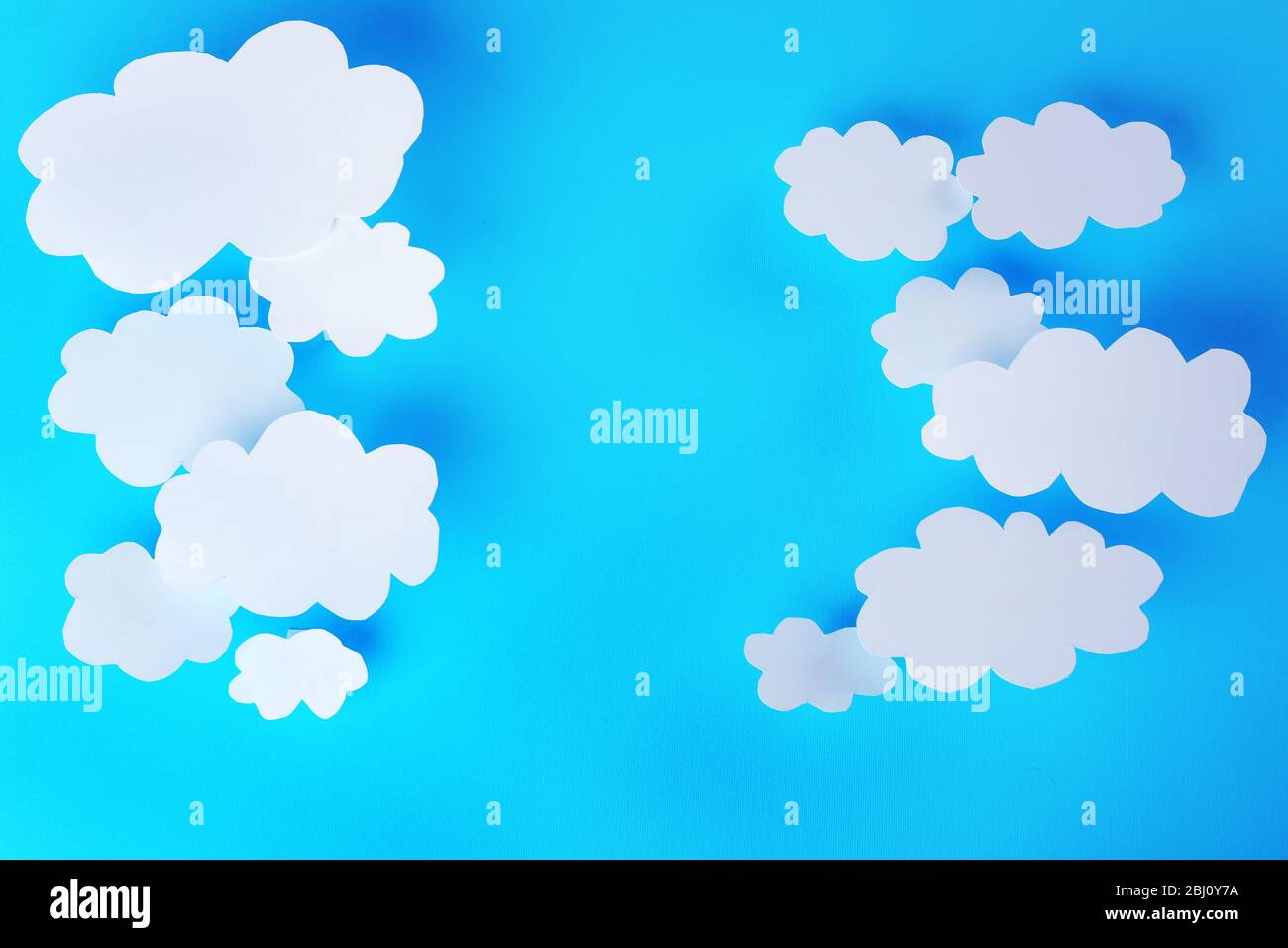 White paper clouds on blue background. Cloud computing concept Stock ...