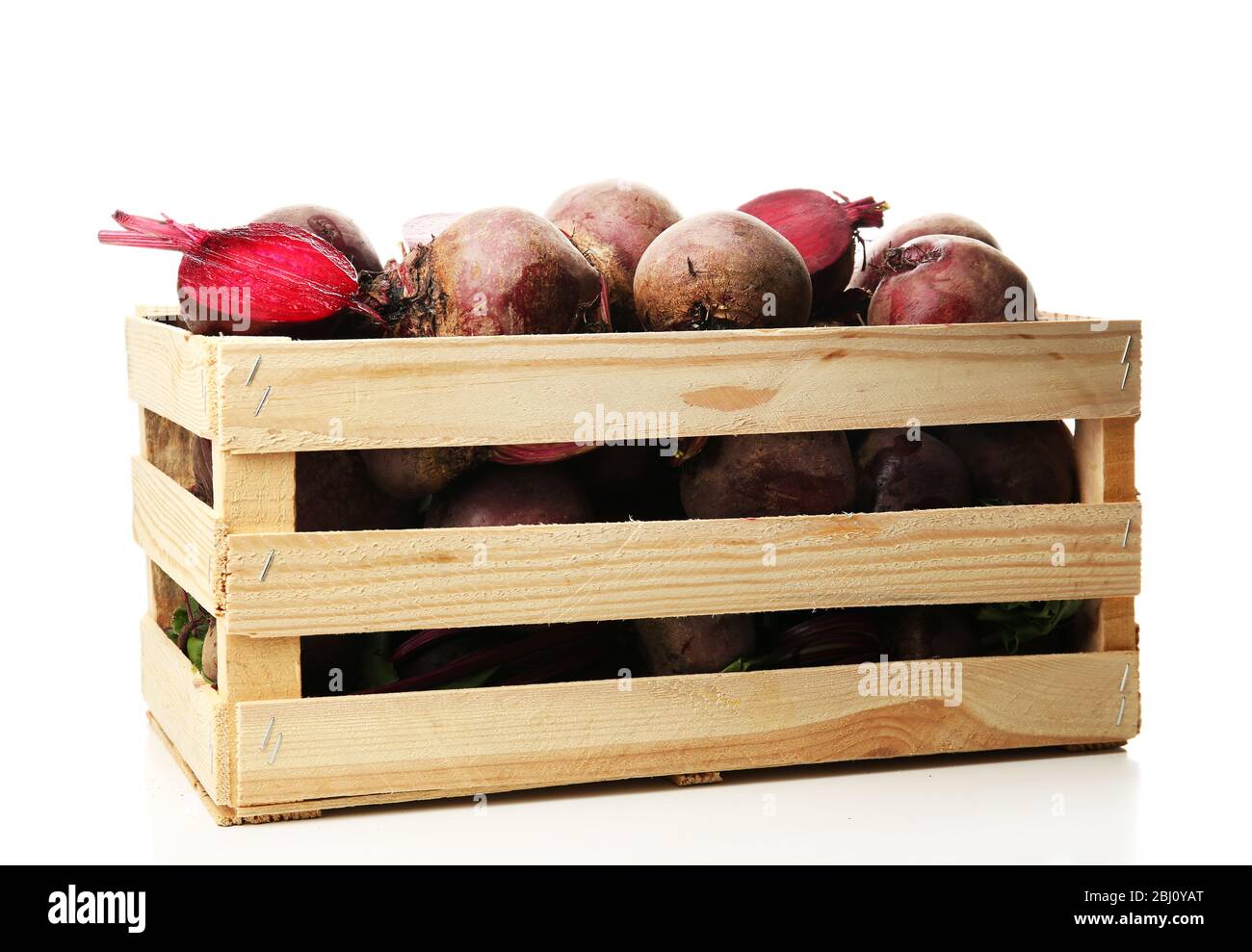 Wooden crate of beets isolated on white Stock Photo - Alamy
