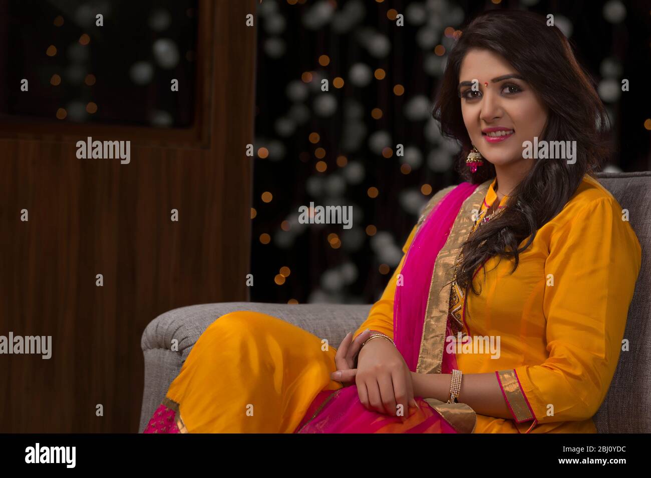 Pretty indian woman sitting on hi-res stock photography and images - Alamy