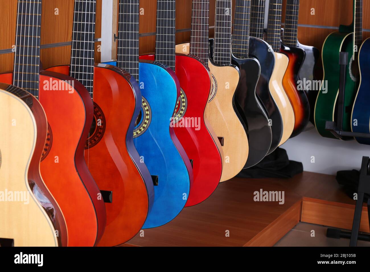 Guitars in music store Stock Photo - Alamy