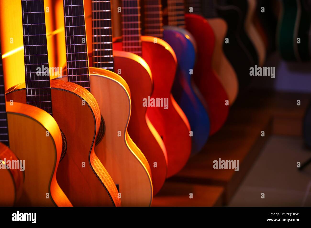 Guitars in music store Stock Photo - Alamy