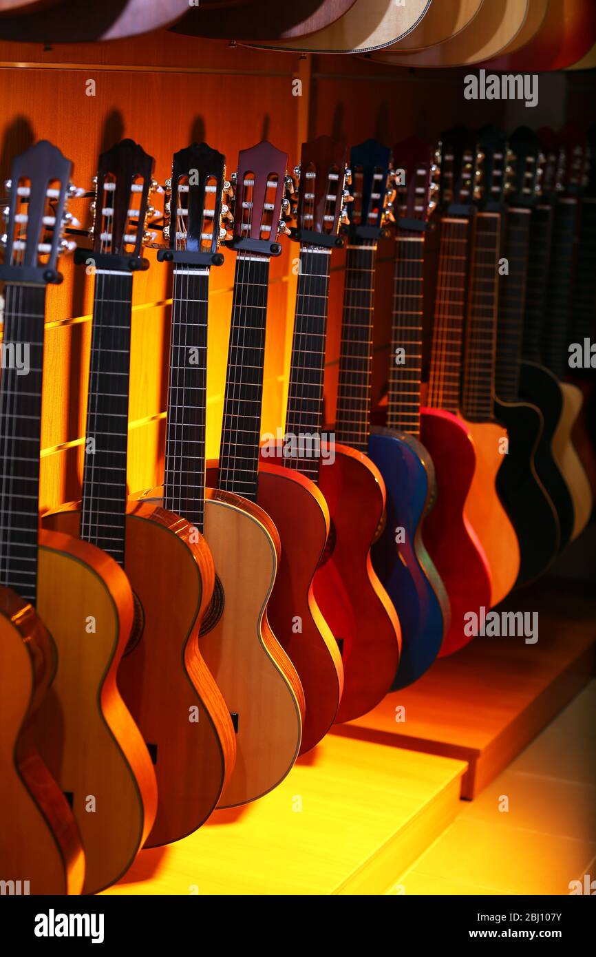 Guitars in music store Stock Photo - Alamy