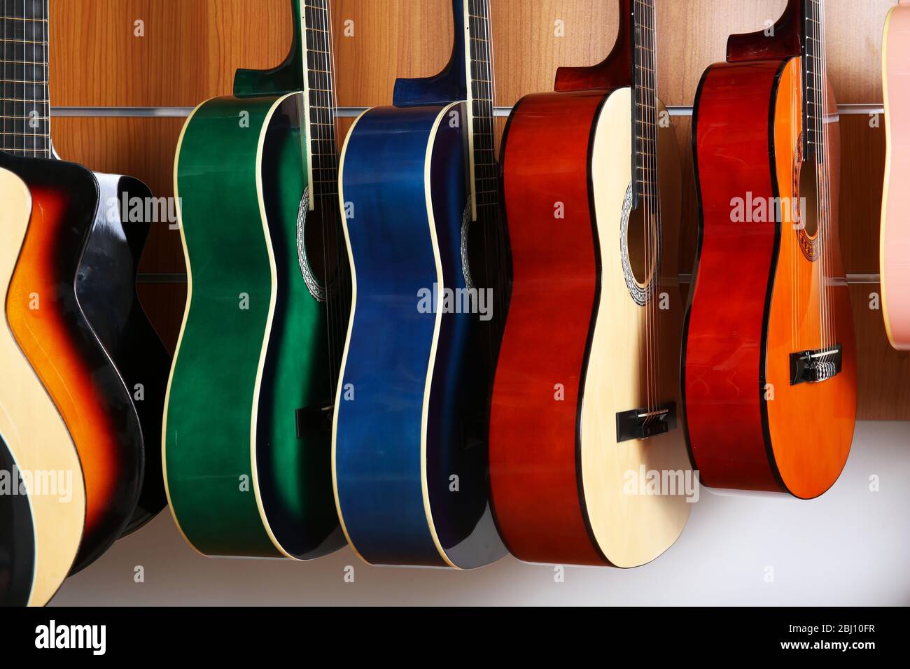 Guitars in music store Stock Photo - Alamy