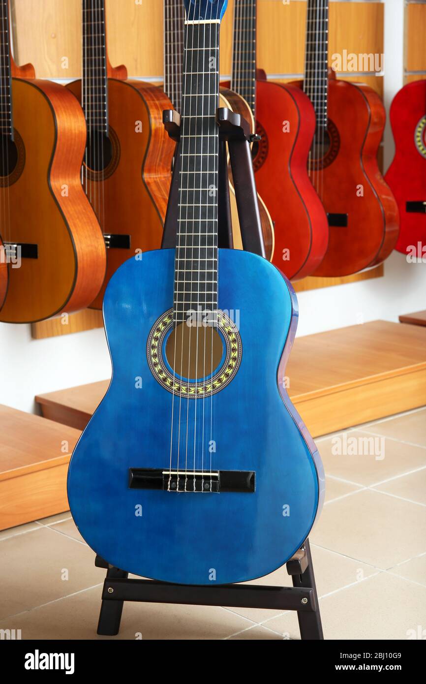 Guitars in music store Stock Photo - Alamy