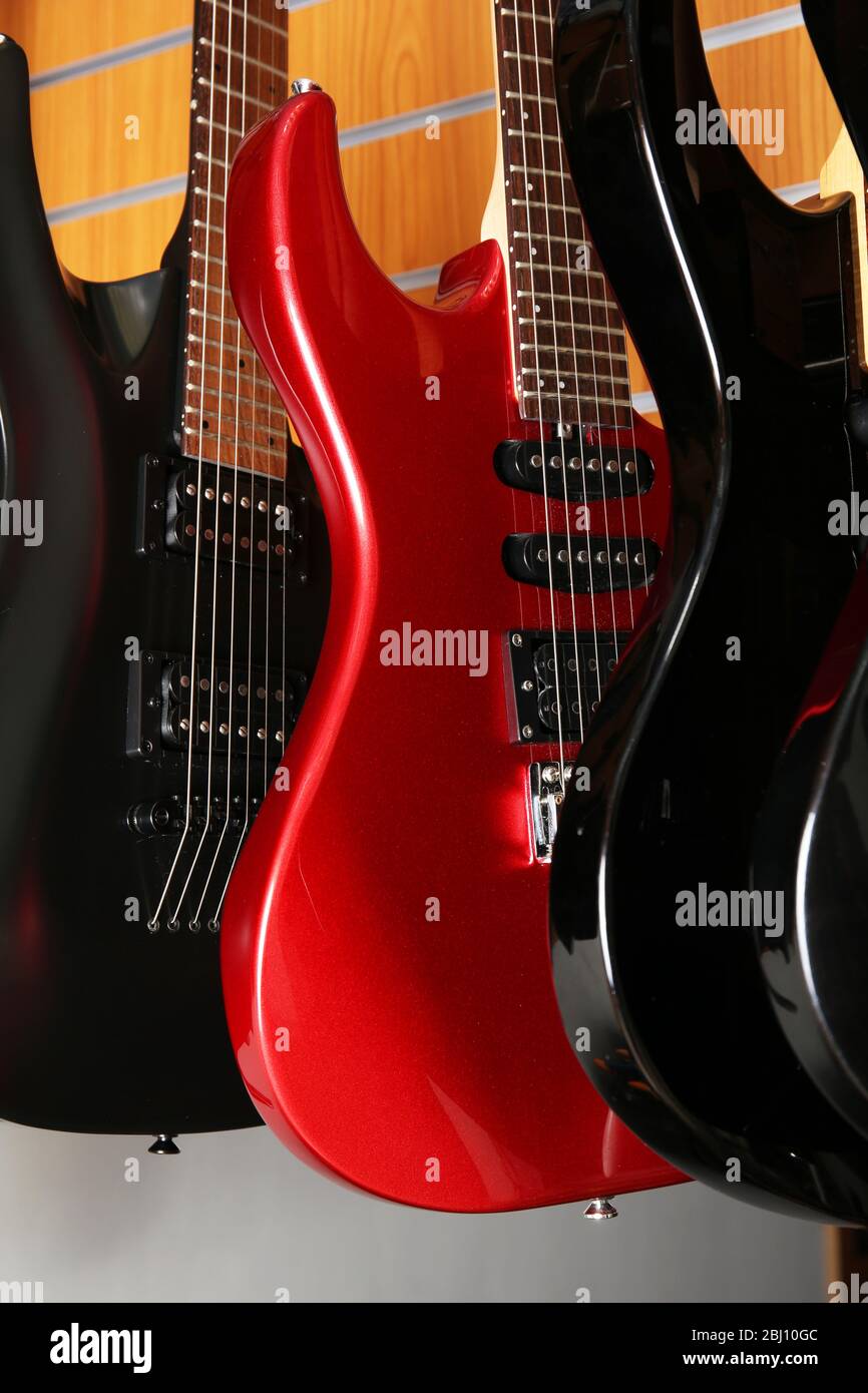 Guitars in music store Stock Photo - Alamy