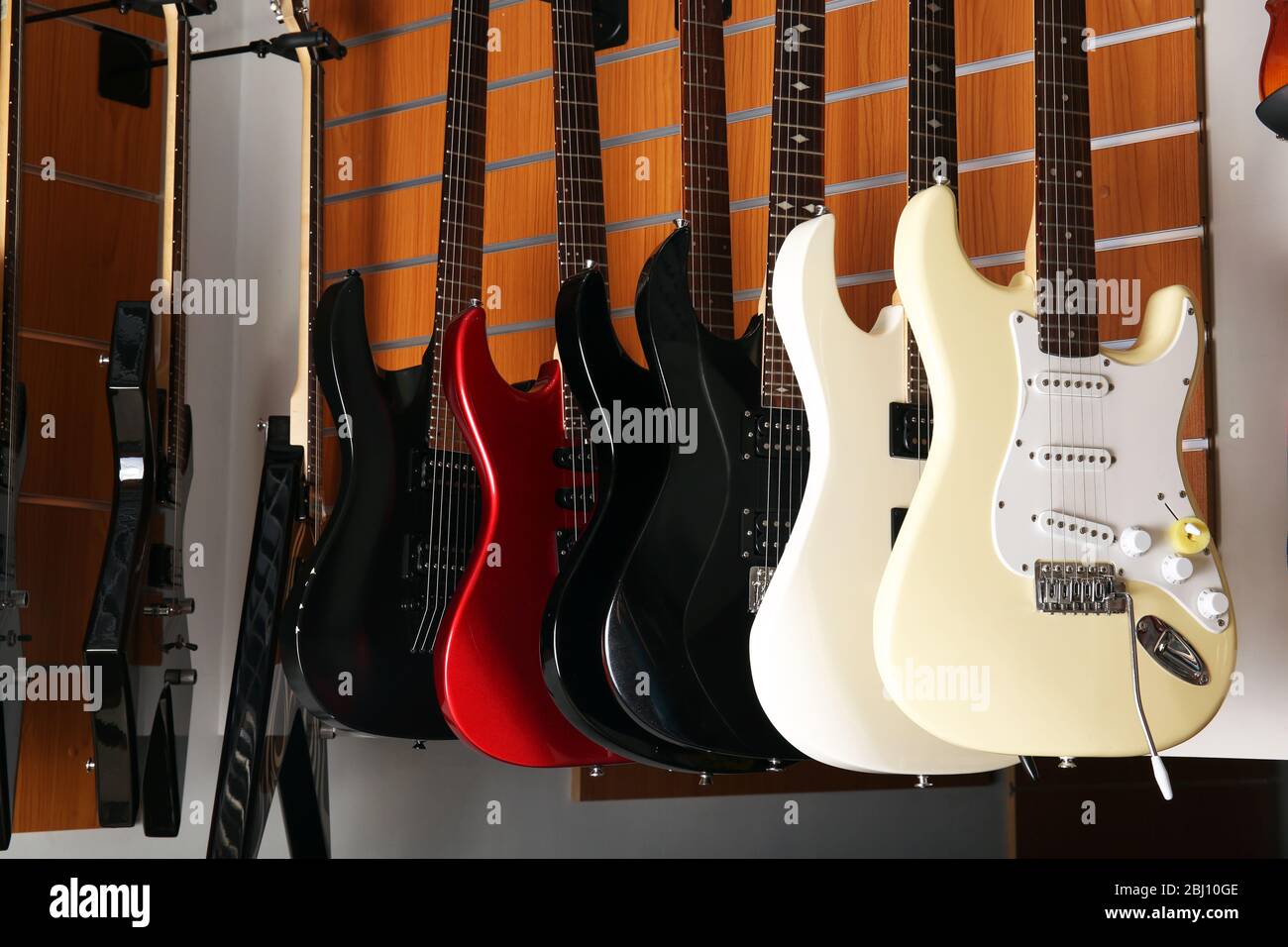 Guitars in music store Stock Photo - Alamy