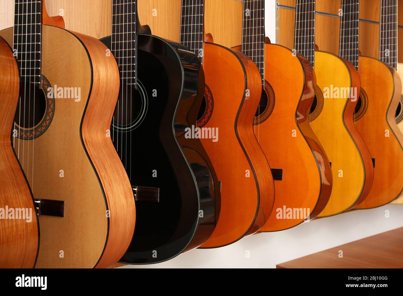 Guitars in music store Stock Photo - Alamy