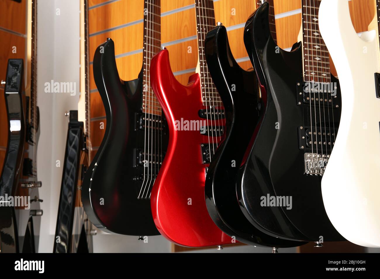 Guitars in music store Stock Photo - Alamy