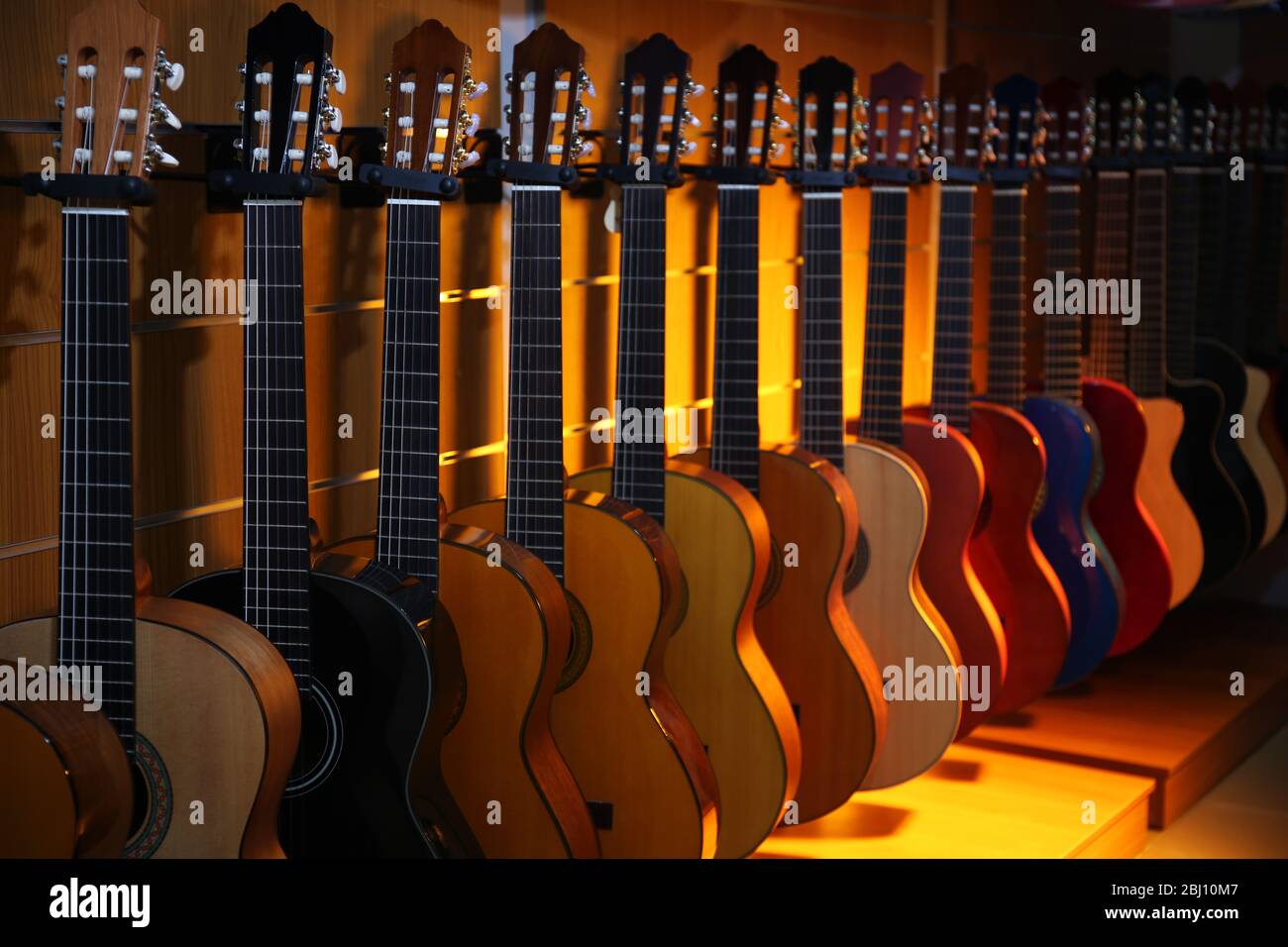 Guitars in music store Stock Photo - Alamy