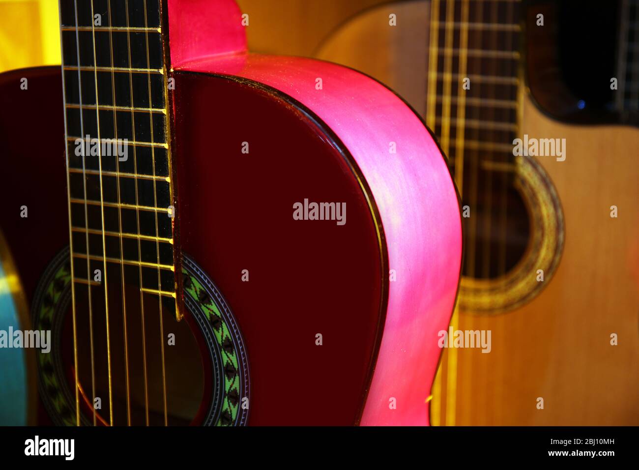 Guitars in music store Stock Photo - Alamy