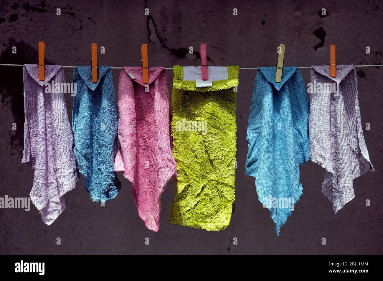row of colorful microfiber rags hung out to dry Stock Photo - Alamy