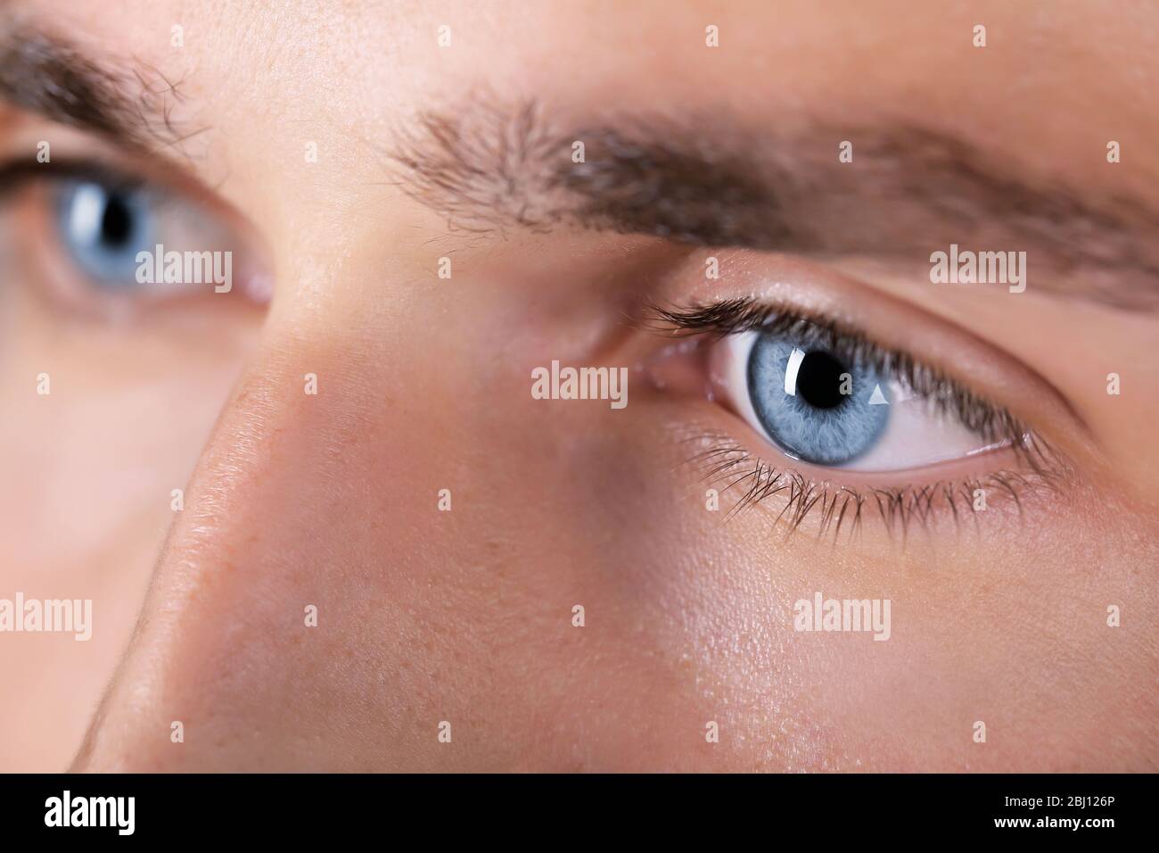 Beautiful blue man eyes close up Stock Photo - Alamy