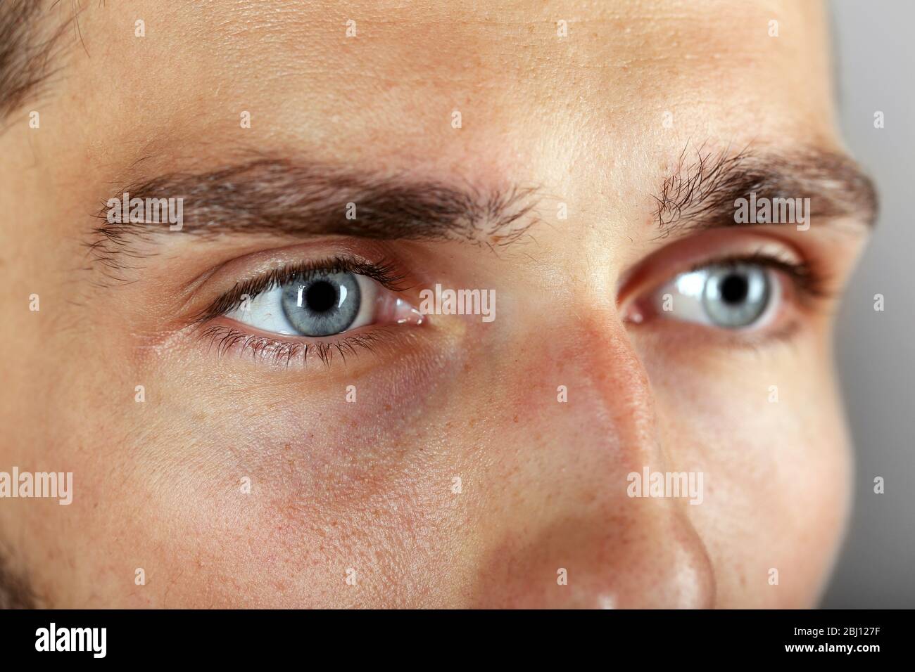 Beautiful blue man eyes close up Stock Photo - Alamy