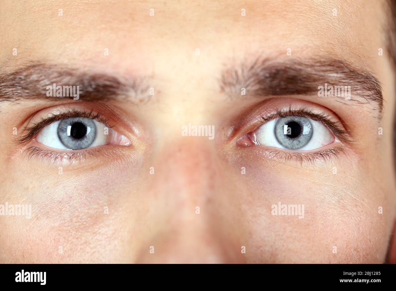 Beautiful blue man eyes close up Stock Photo - Alamy