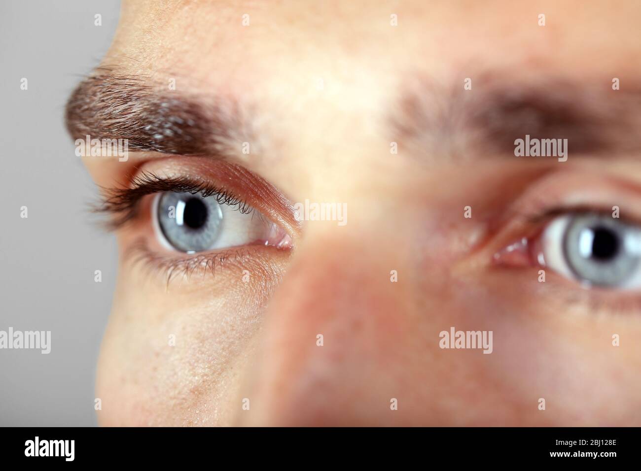 Beautiful blue man eyes close up Stock Photo - Alamy
