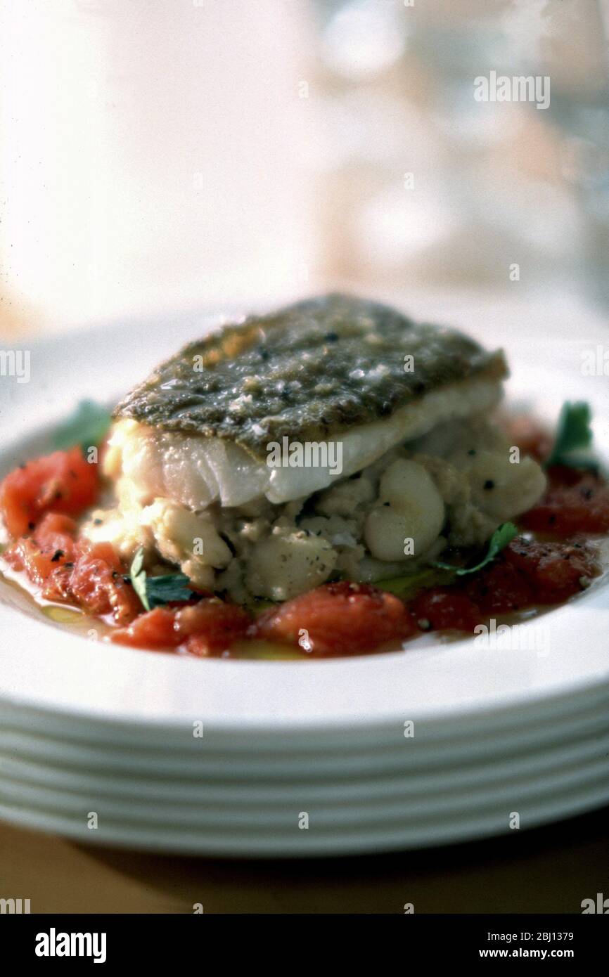Fish on beans Stock Photo - Alamy