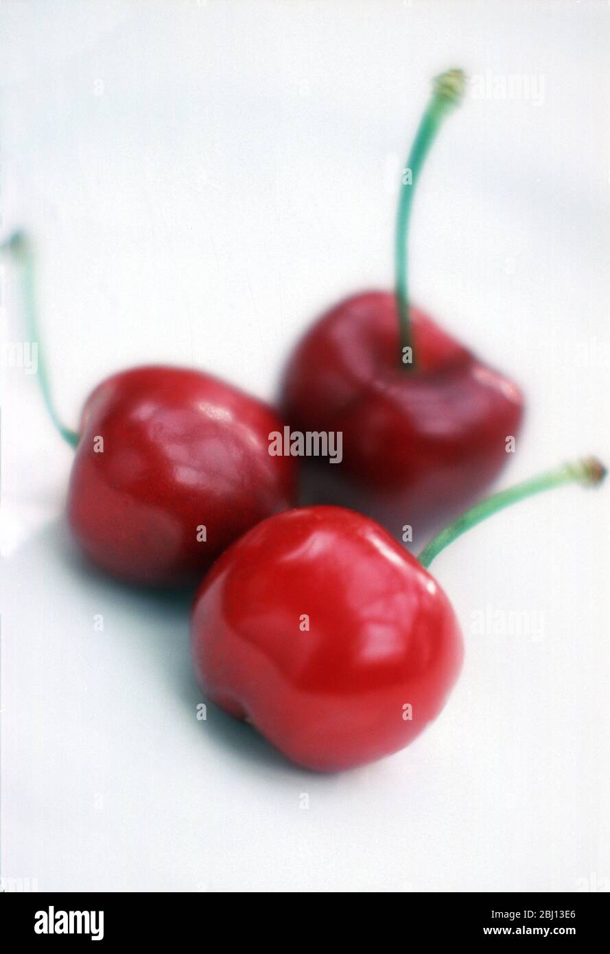 Three cherries Stock Photo - Alamy