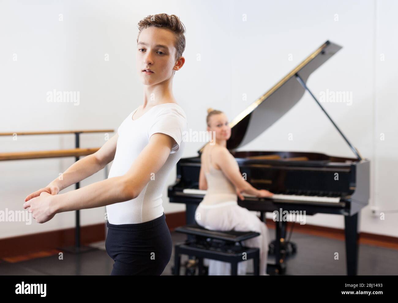 Female choreographer teaches young dancer in ballet studio Stock Photo ...