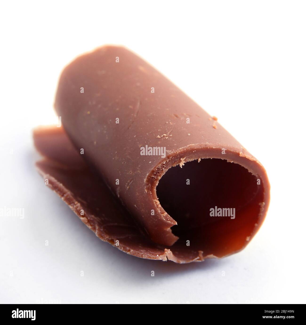 Chocolate curl isolated on white Stock Photo - Alamy