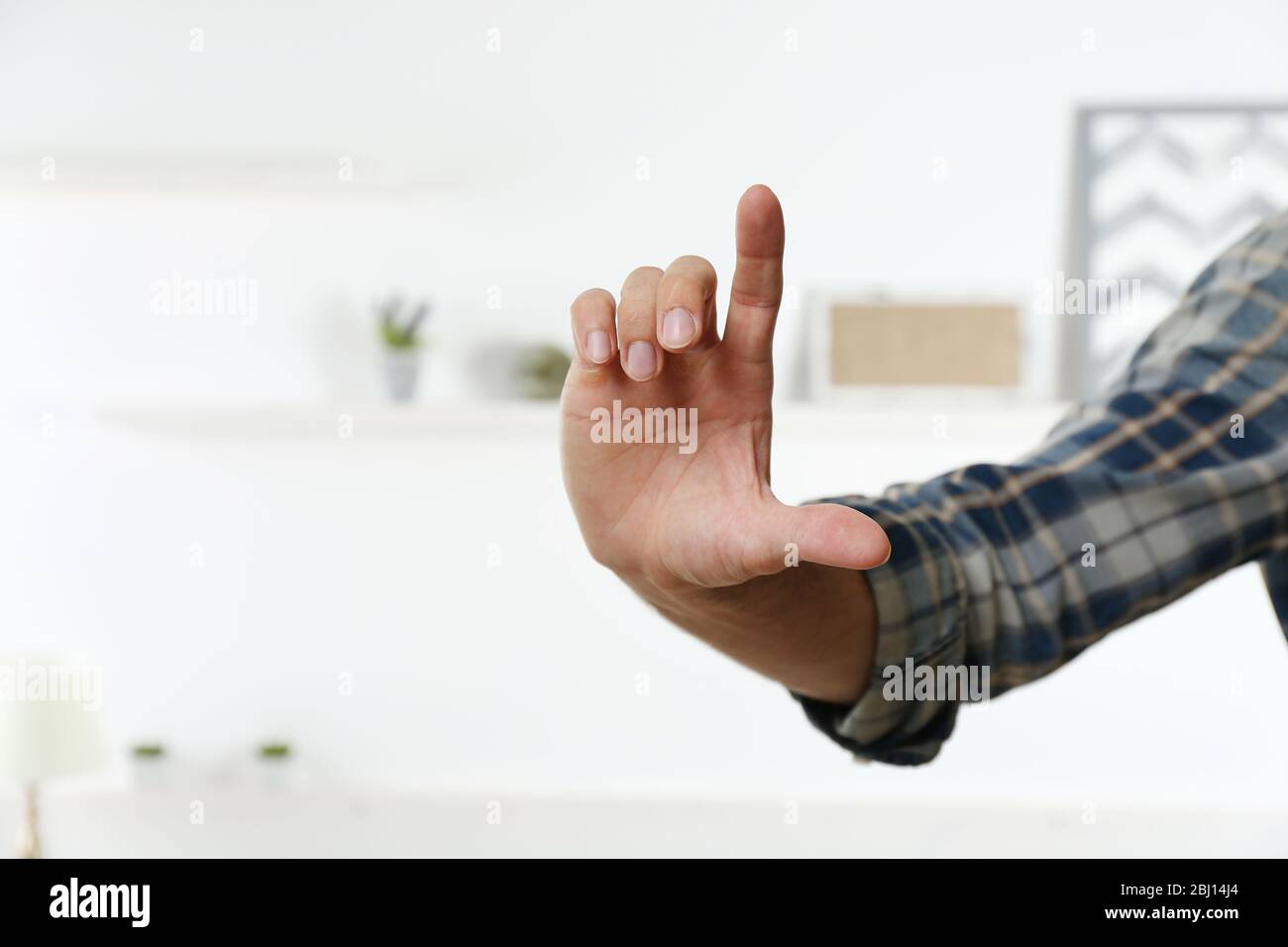 Young man push button Stock Photo - Alamy