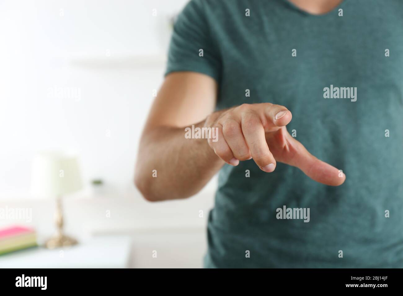 Young man push button Stock Photo - Alamy