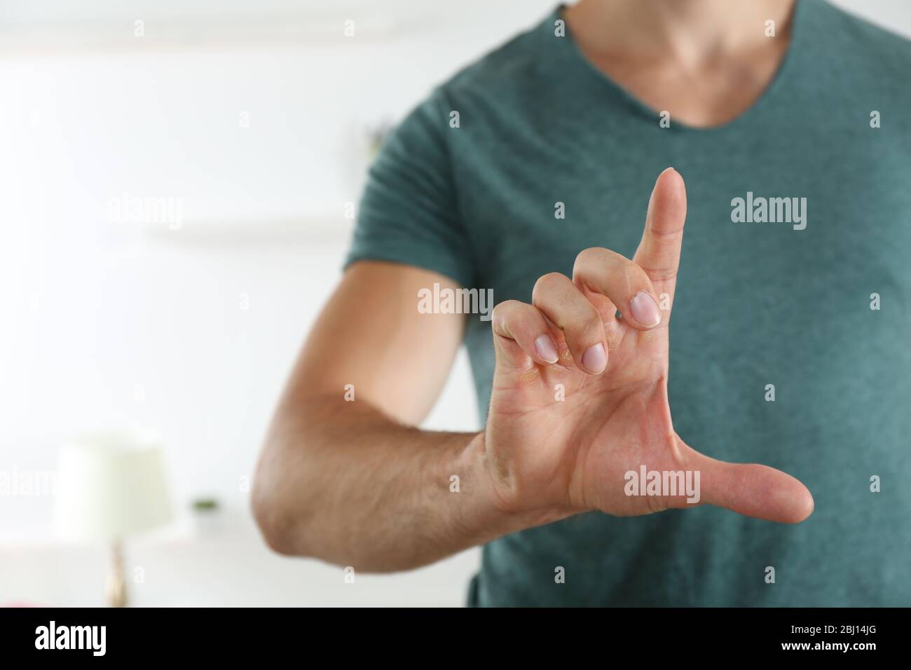 Young man push button Stock Photo - Alamy