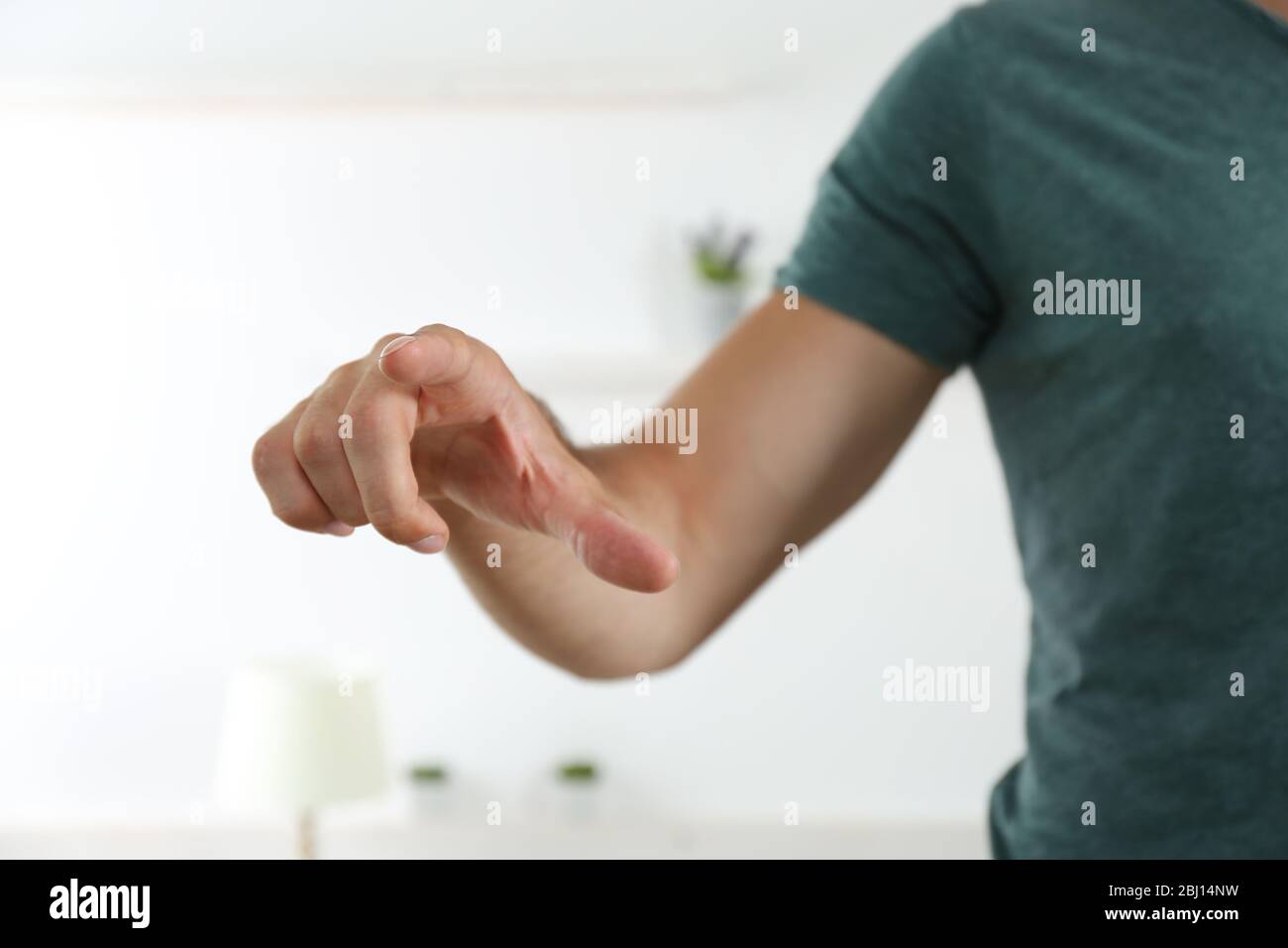 Young man push button Stock Photo - Alamy