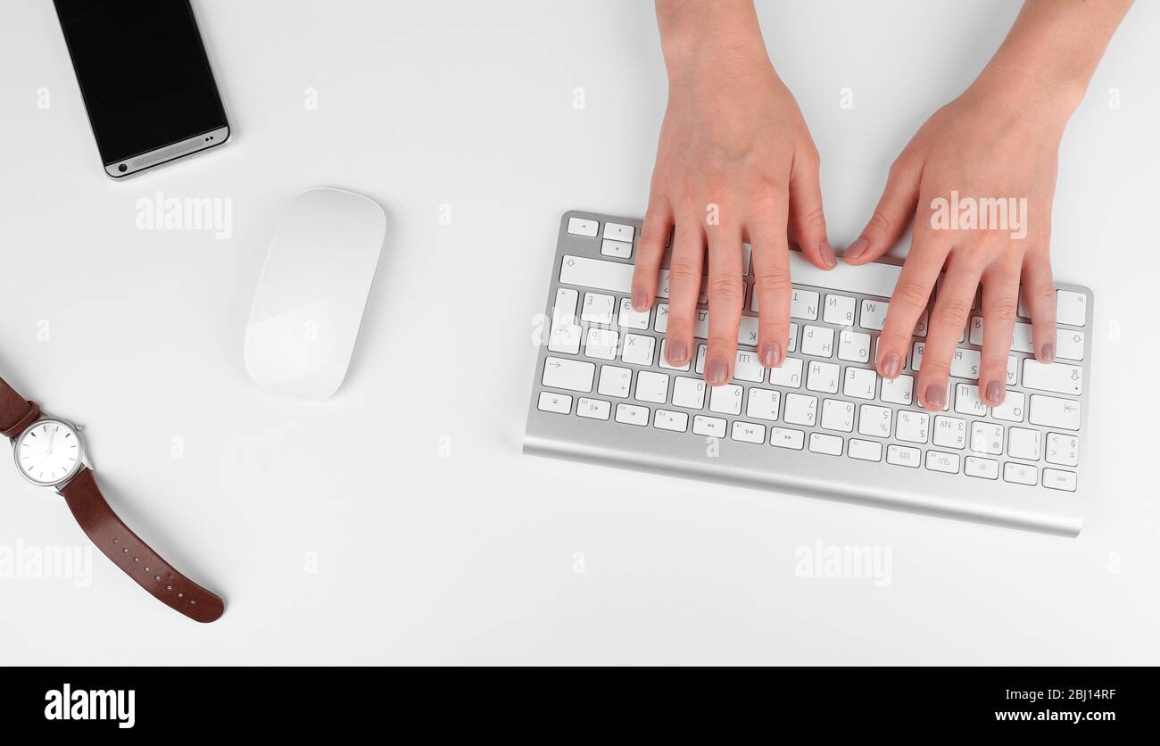 Female hand with computer keyboard isolated on white Stock Photo - Alamy