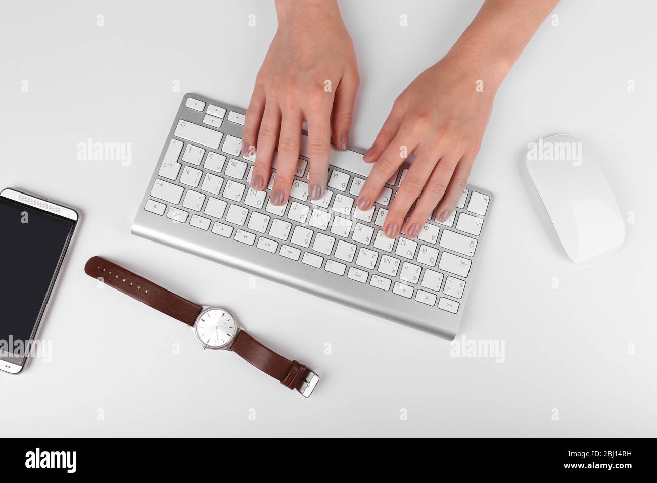 Female hand with computer keyboard isolated on white Stock Photo - Alamy