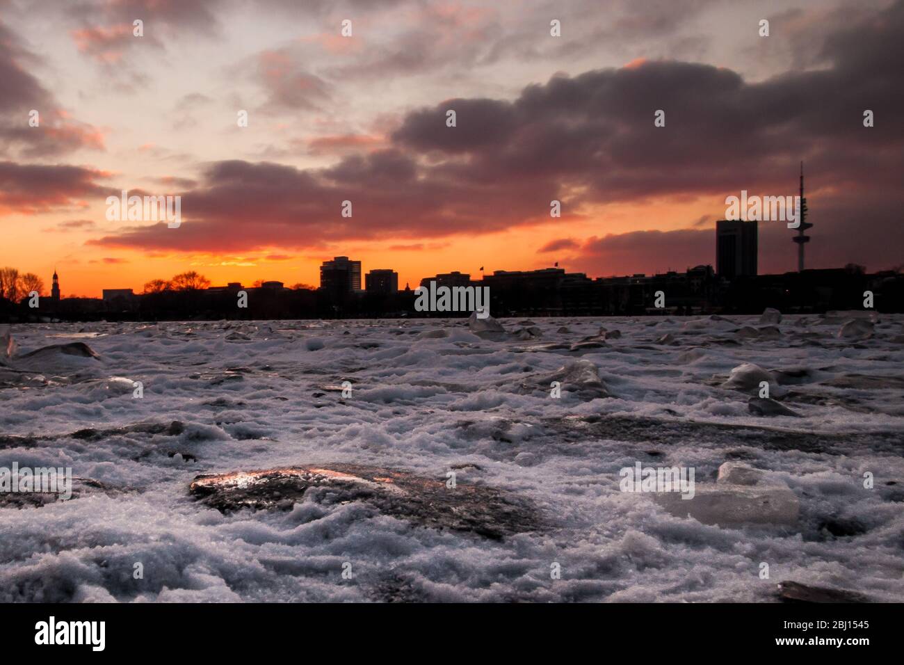 The frozen Outer Alster in Hamburg in winter in the sunset Stock Photo ...