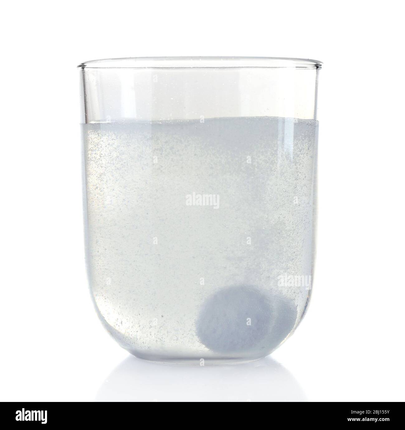 Pill in glass of water on light background Stock Photo - Alamy