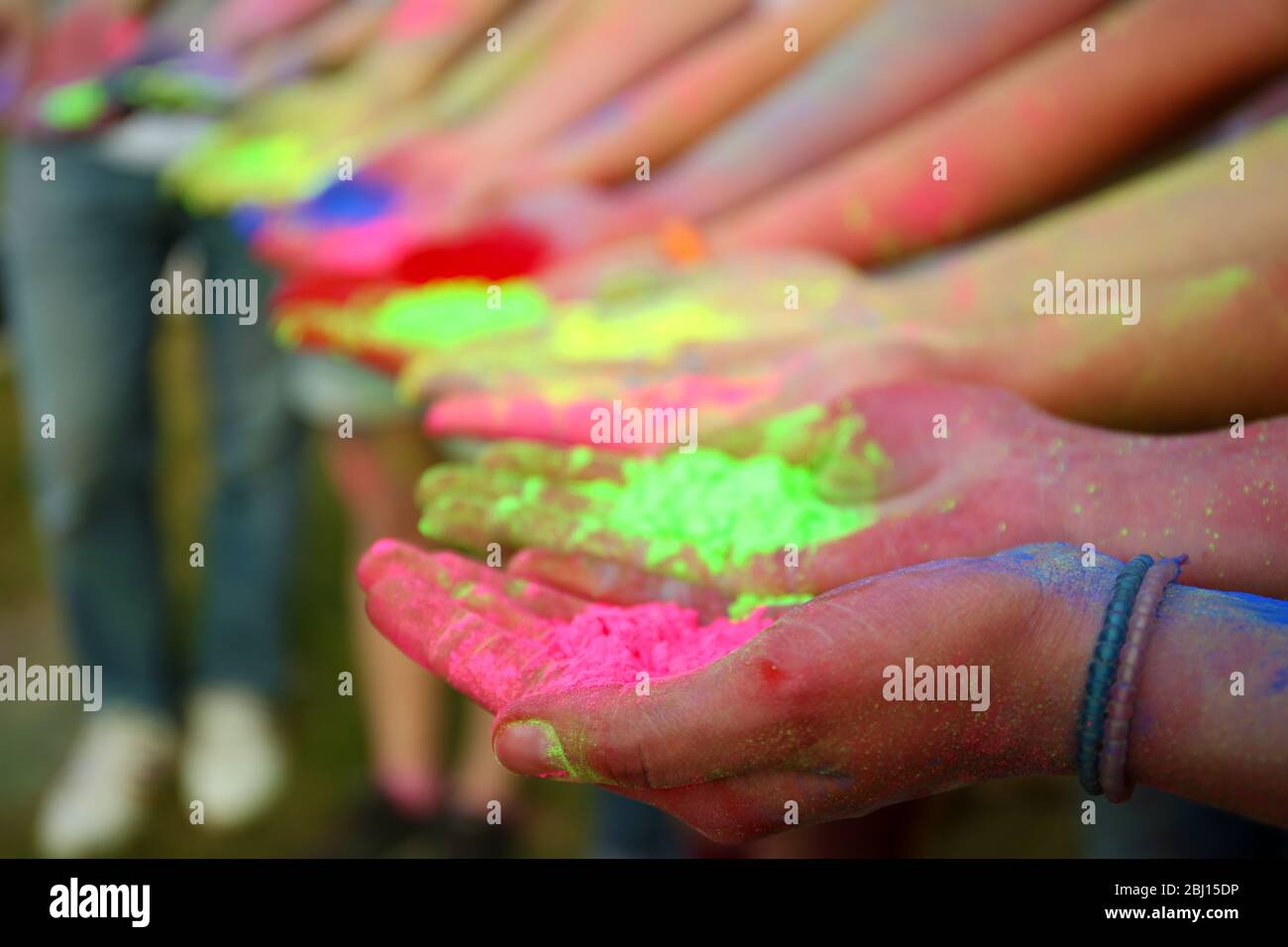 Hands of young people with Indian dyes on Holi color festival Stock ...