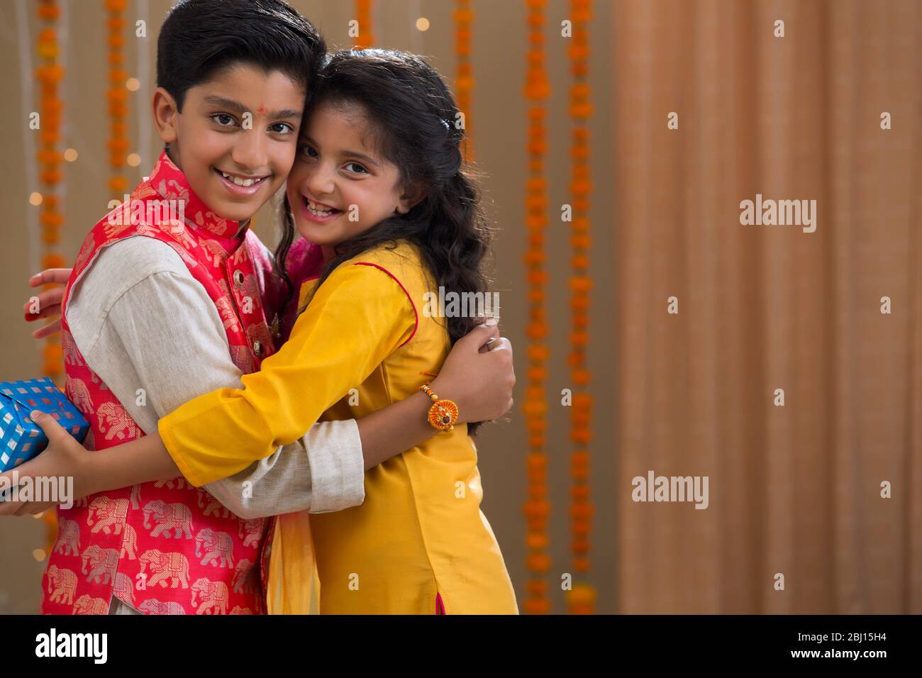 brother and sister hugging each other Stock Photo - Alamy
