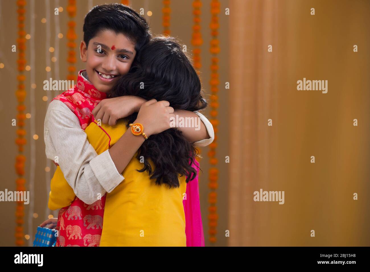 brother and sister hugging each other Stock Photo - Alamy