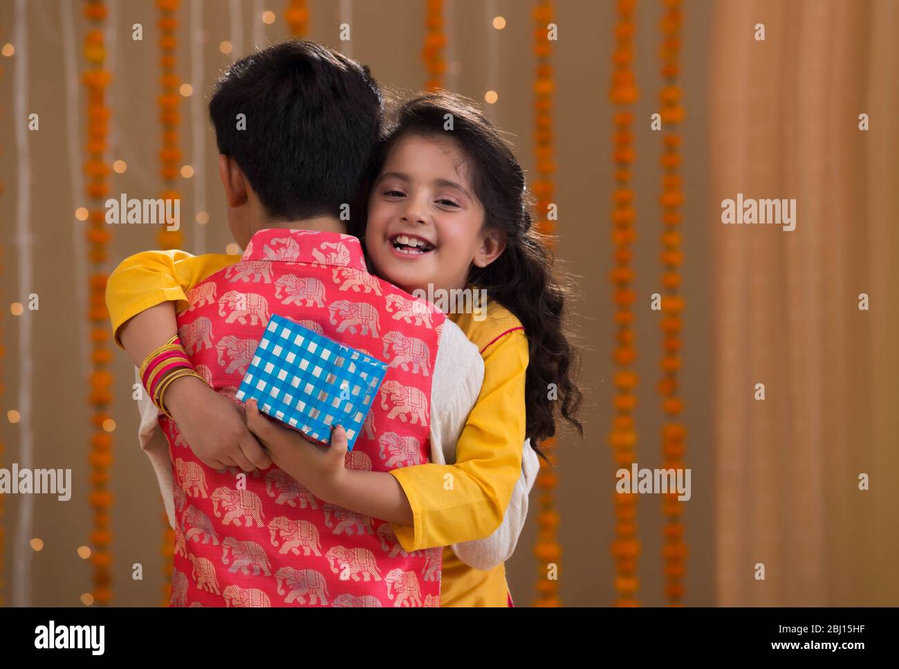 brother and sister hugging each other Stock Photo - Alamy
