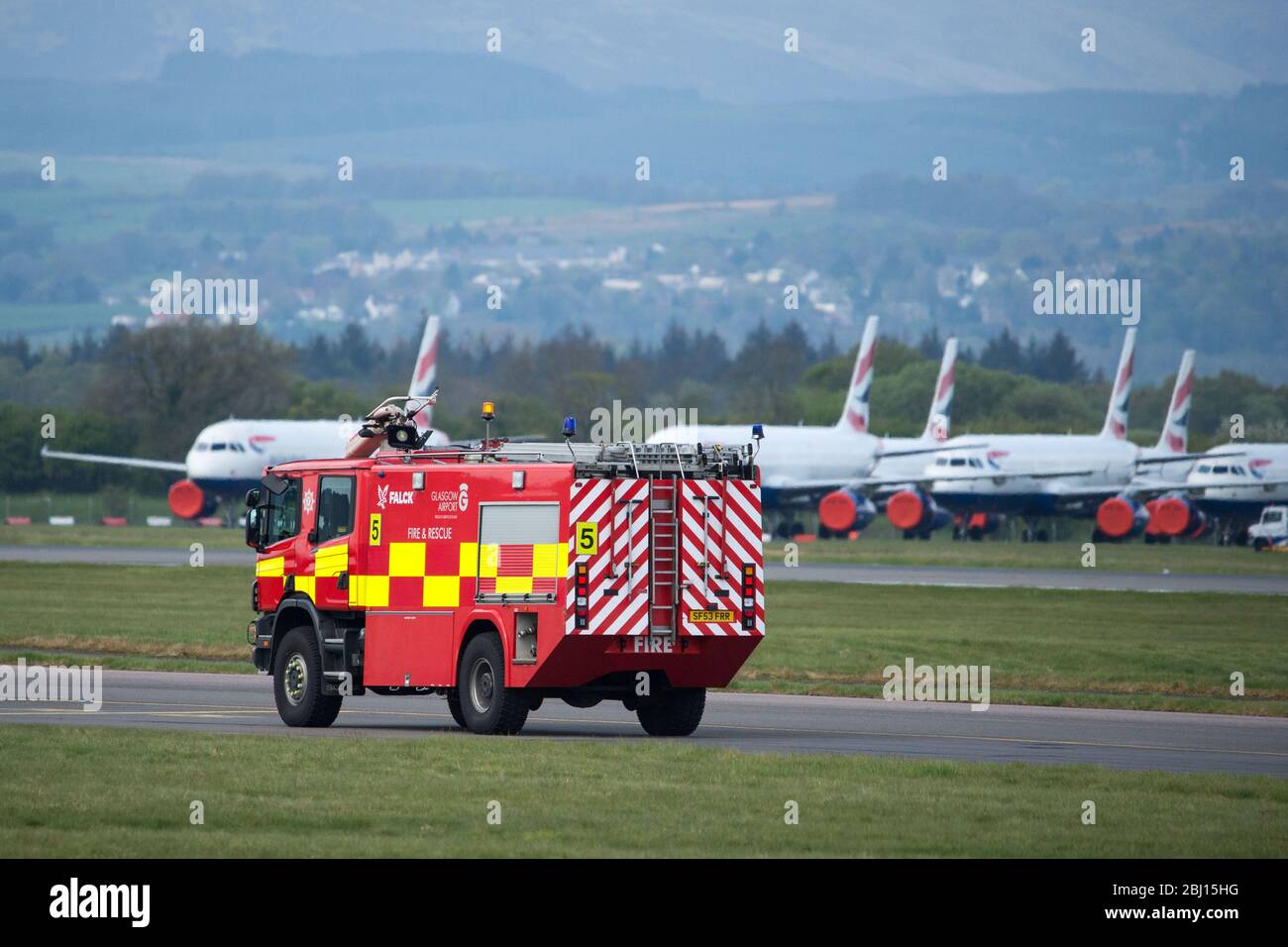 Airport fire engine with planes in background hi-res stock photography ...