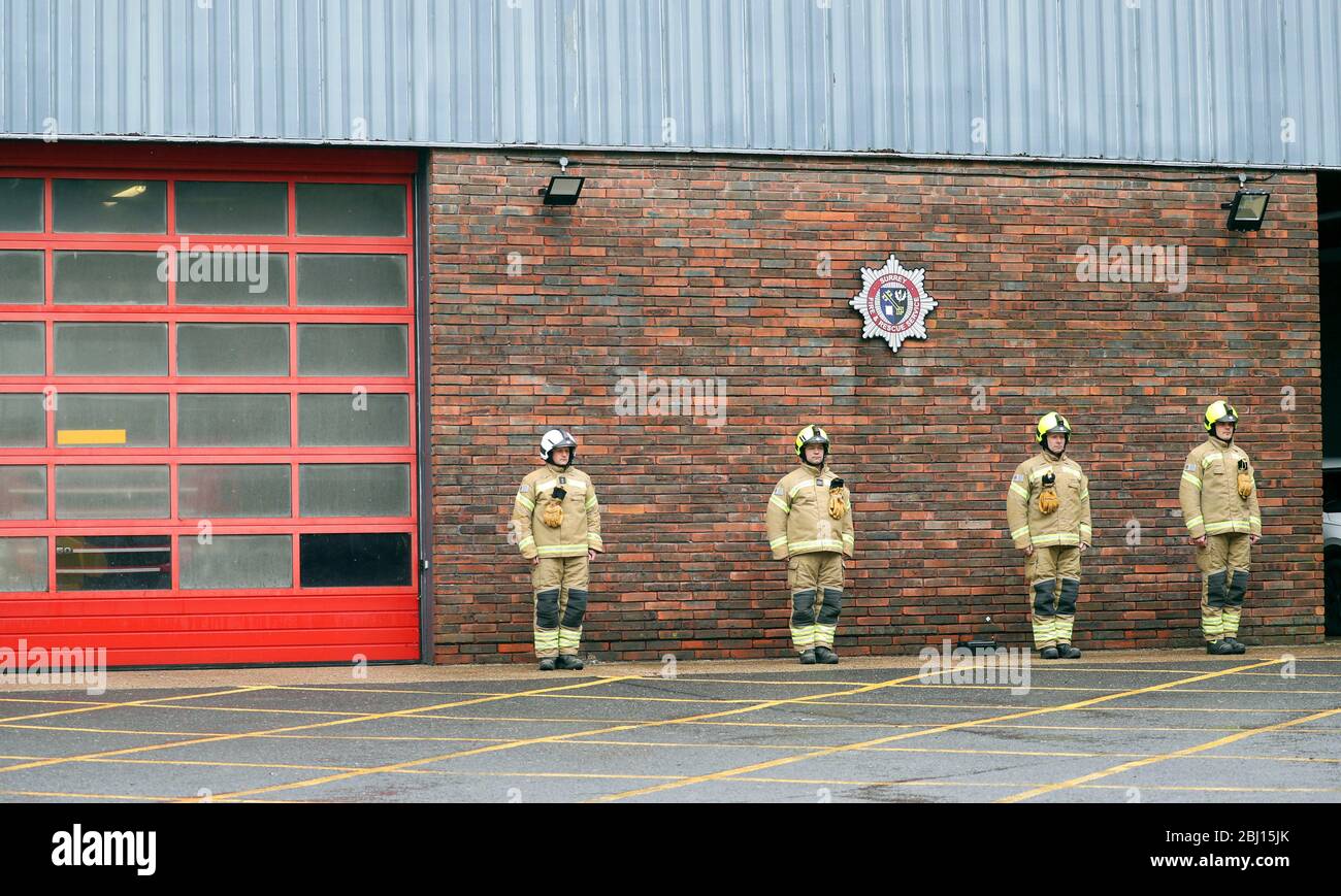 Firefighters outside Godstone fire station during a minute's silence to ...