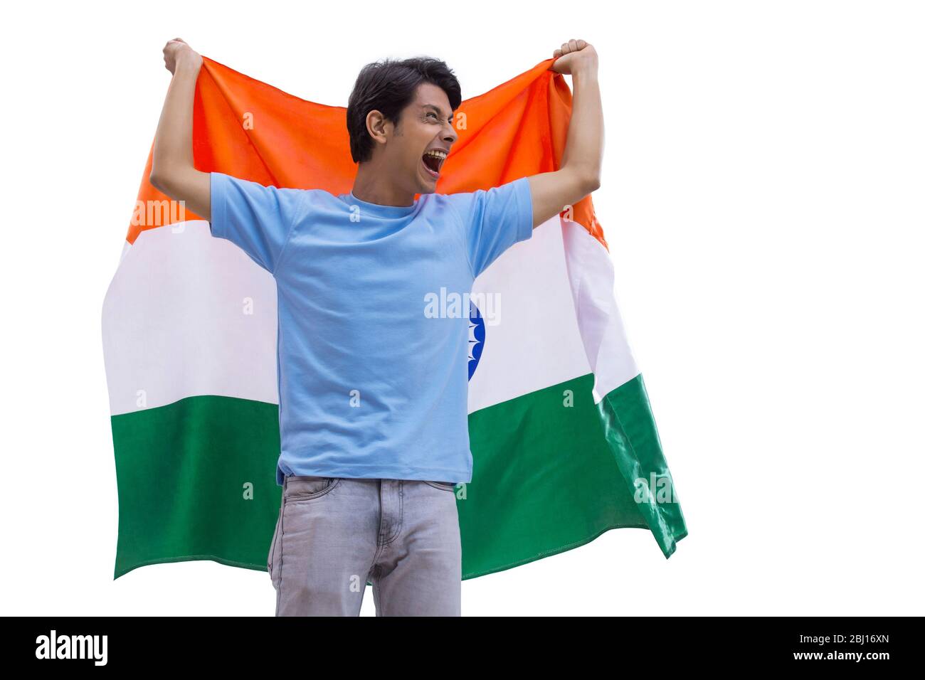 young man lifting indian flag in excitement, independence day Stock ...