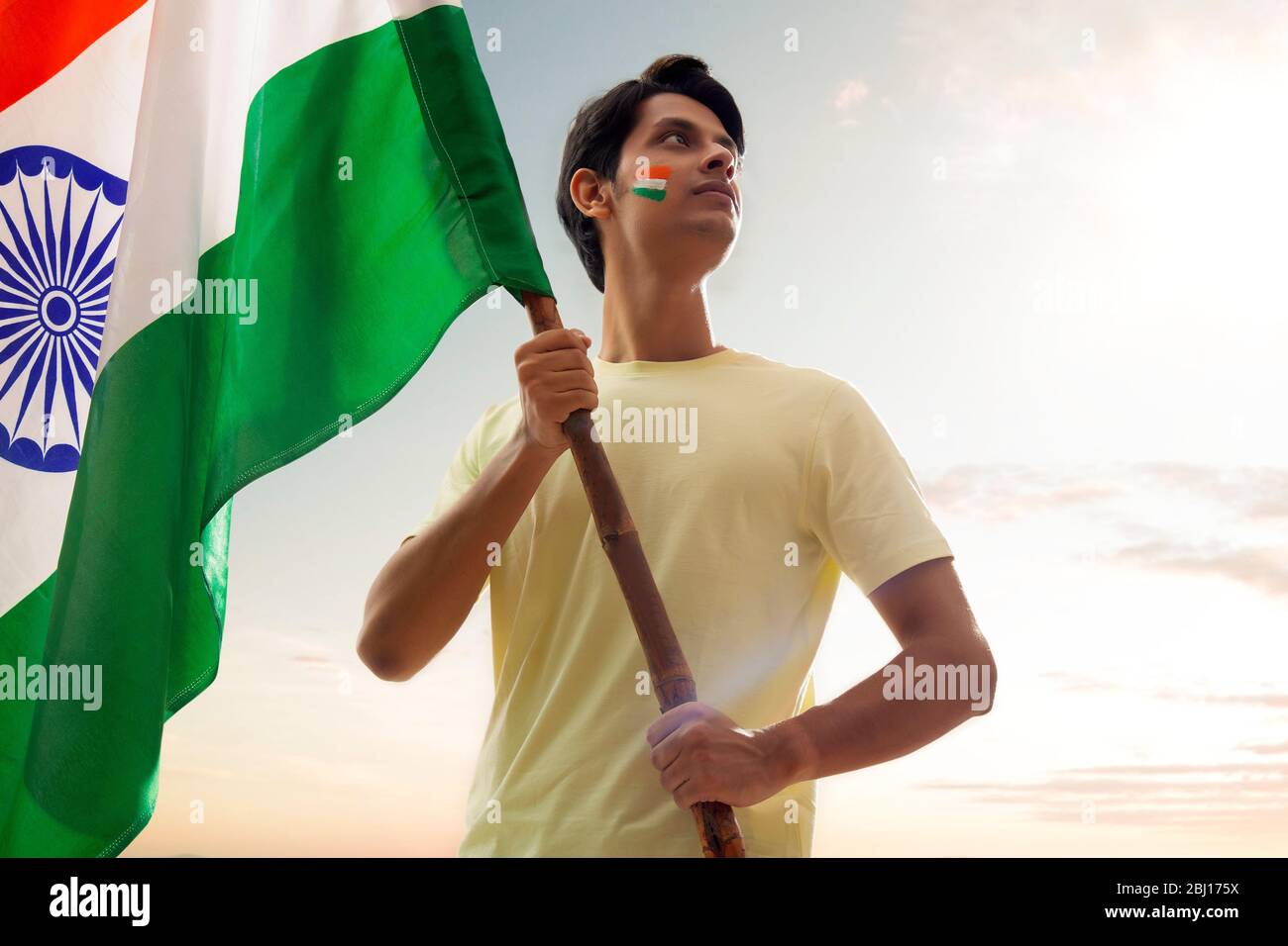 young man holding indian flag proudly, independence day Stock Photo - Alamy