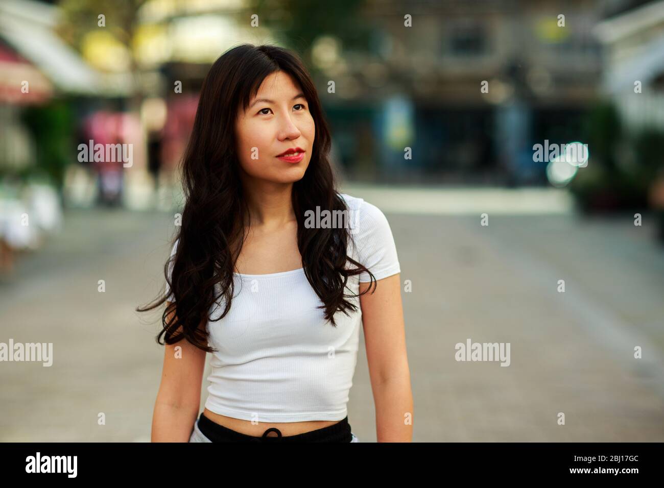 a young chinese lady in the street Stock Photo - Alamy
