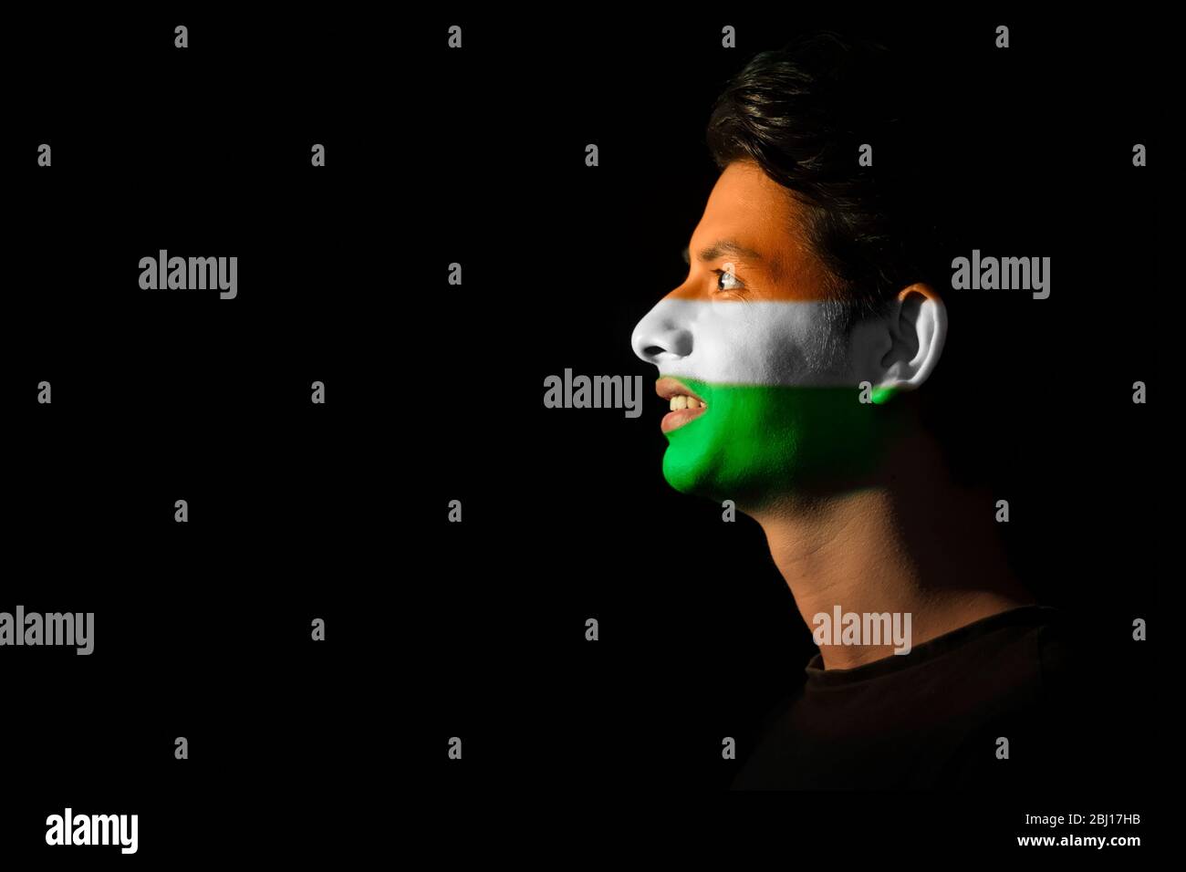 man smiling with tricolour painted on his face, independence day Stock ...