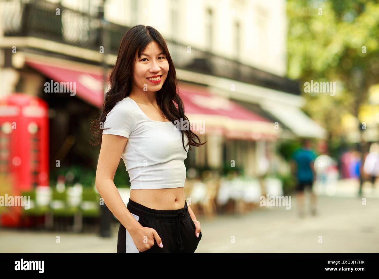 a young chinese lady in the street Stock Photo - Alamy